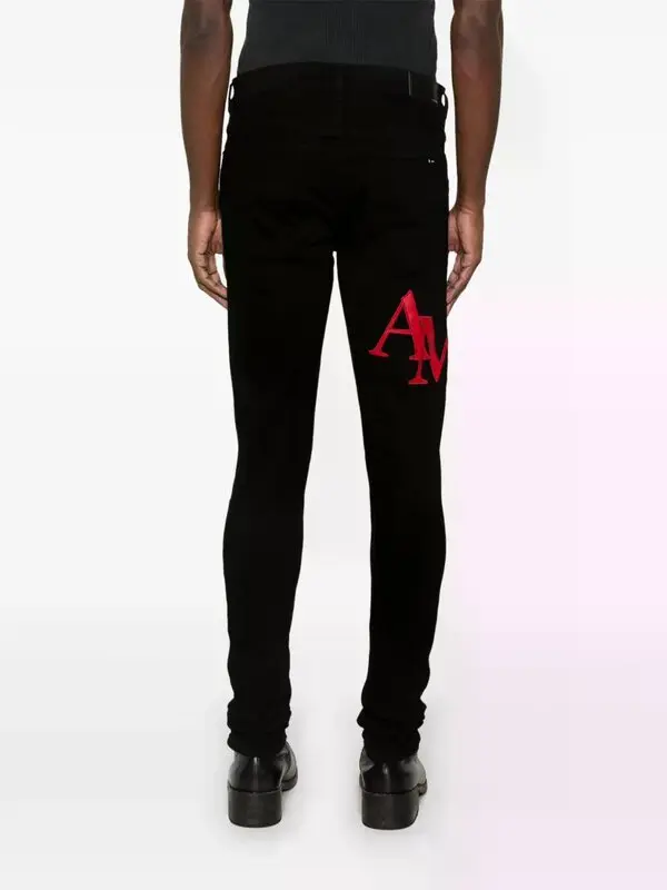 Amiri Staggered Logo Skinny Jeans