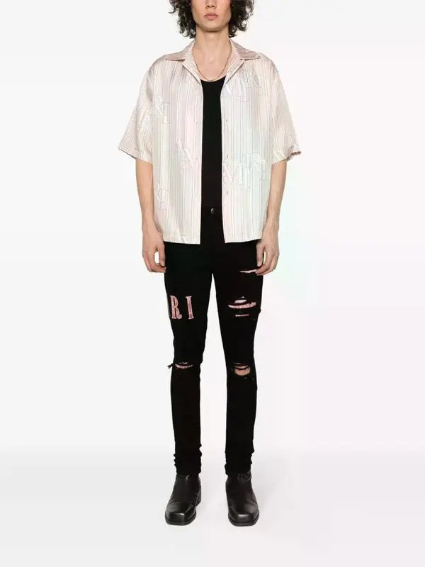 Amiri Waxed Logo-appliqué Skinny Jeans