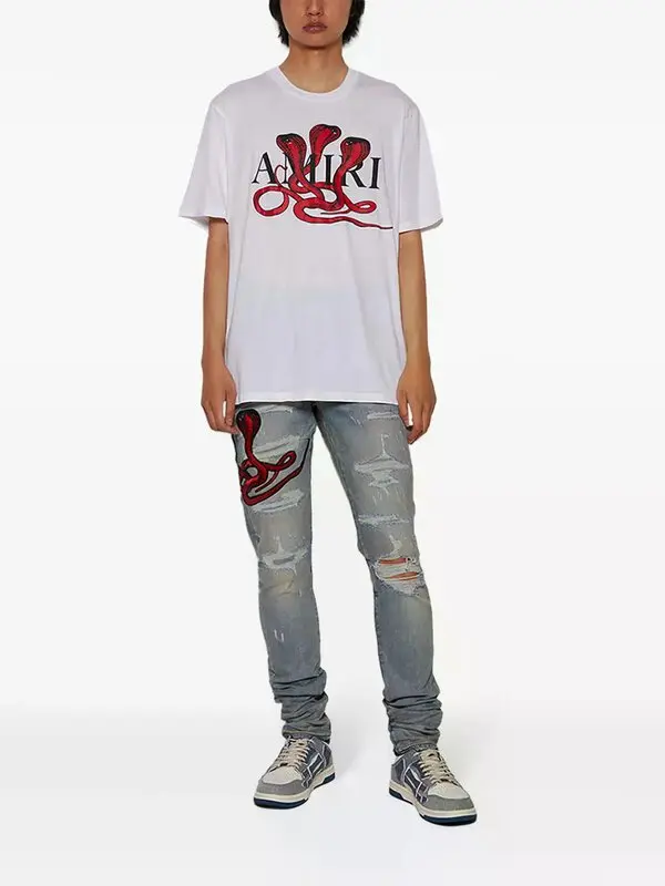 Amiri Appliqué Distressed Skinny Jeans