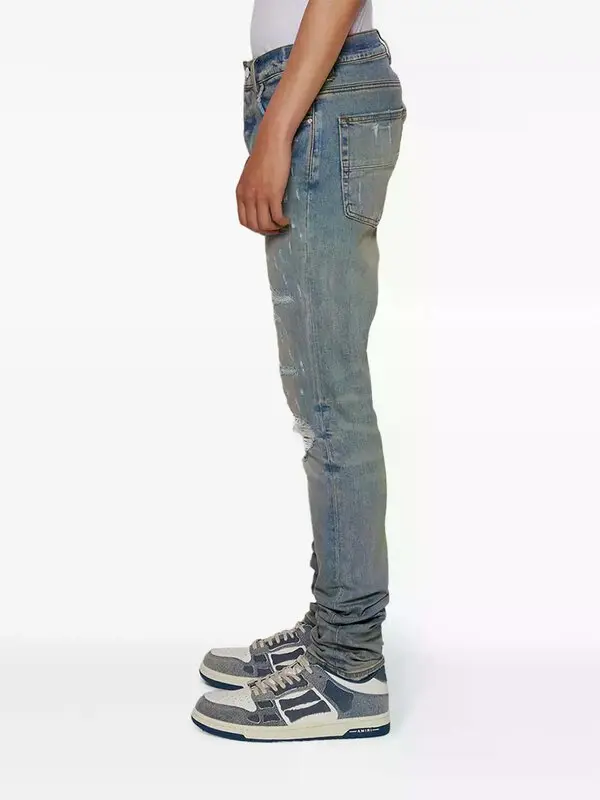 Amiri Appliqué Distressed Skinny Jeans