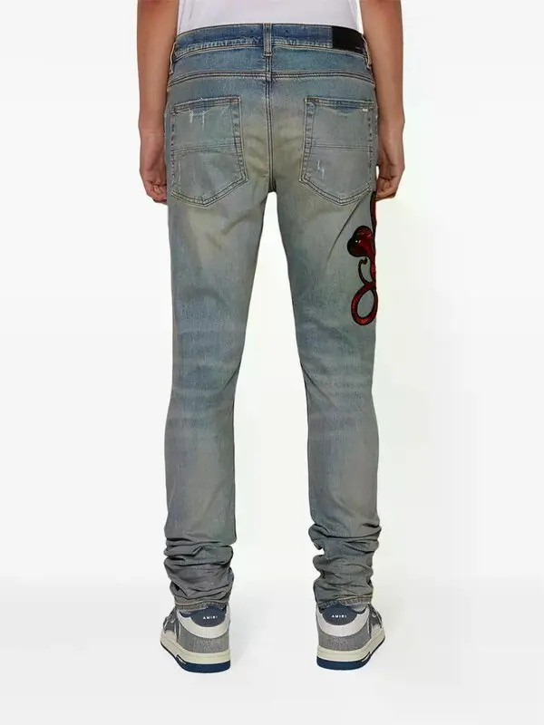 Amiri Appliqué Distressed Skinny Jeans