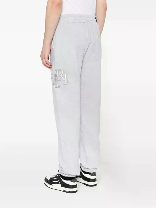 Amiri Staggered Logo-embroidered Track Pants