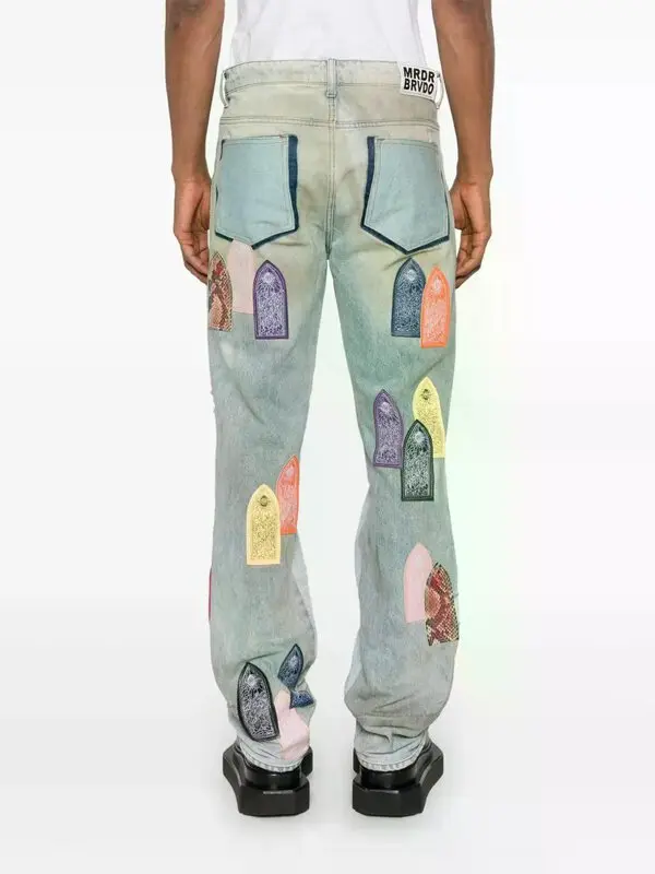 WHO DECIDES WAR Patch Arched Distressed Jeans