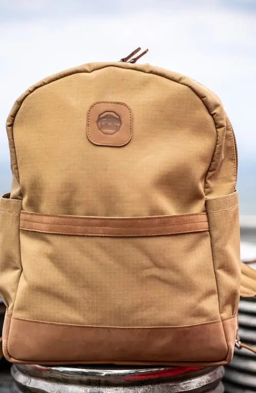 JUBILEE TRADING CO. Cape Buffalo Book Bag - Tan