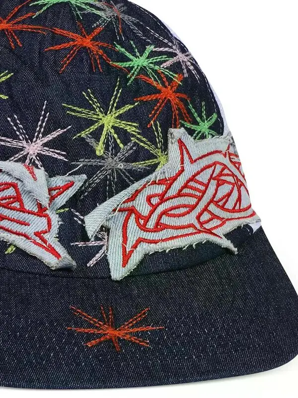 WHO DECIDES WAR BY EV BRAVADO Star-embroidered Trucker Cap