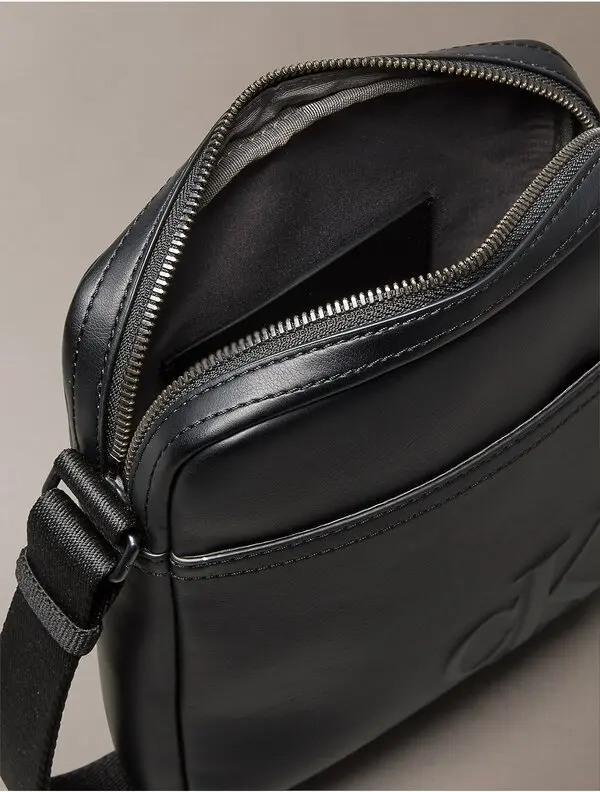 Calvin Klein Embossed Monogram Reporter Bag