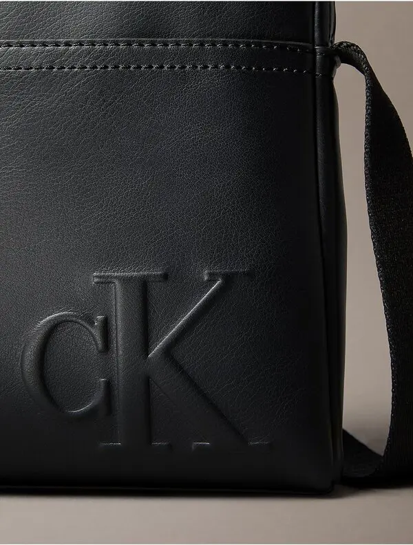 Calvin Klein Embossed Monogram Reporter Bag