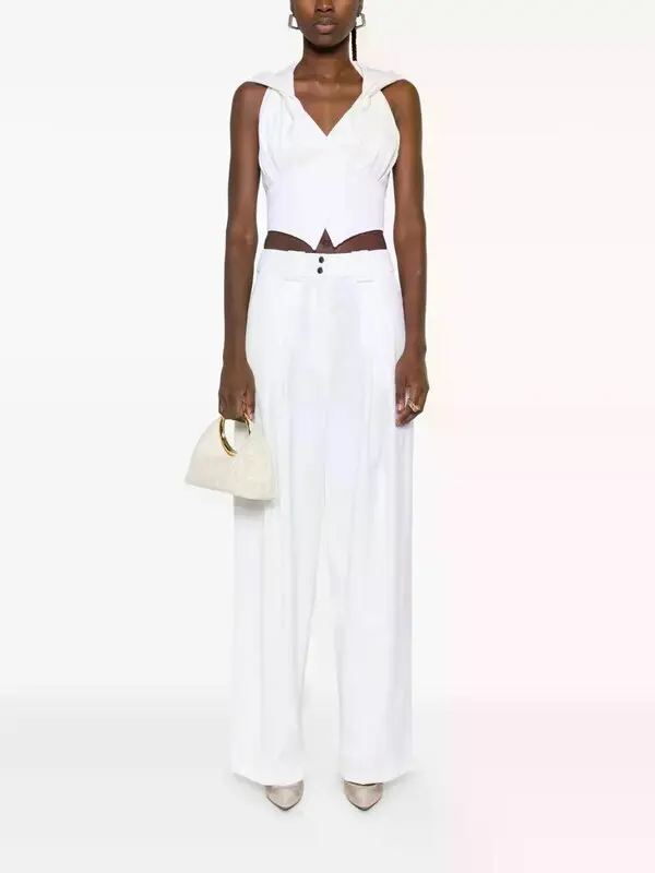 VESTIAIRE D'UN OISEAU LIBRE Pleated-front Trousers