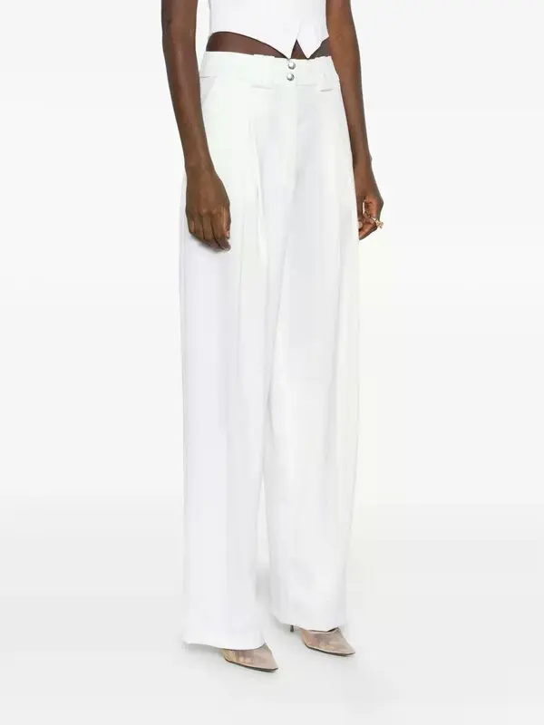 VESTIAIRE D'UN OISEAU LIBRE Pleated-front Trousers