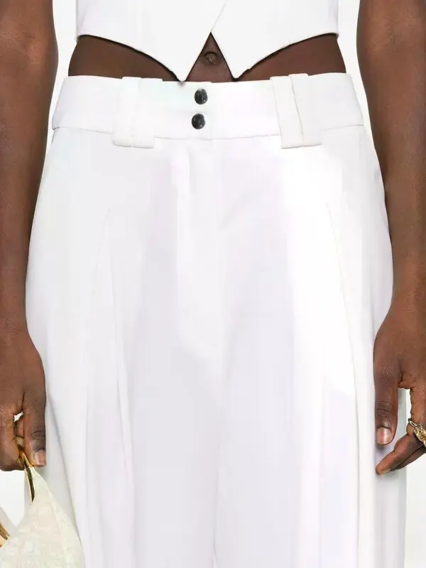 VESTIAIRE D'UN OISEAU LIBRE Pleated-front Trousers