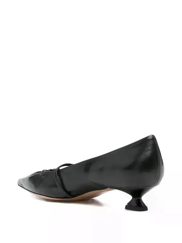 THE SELLER Pointed-toe Buckle Pumps
