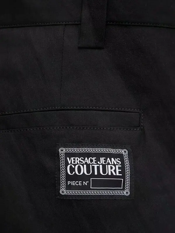 Versace Logo-appliqué Pleat-detail Trousers