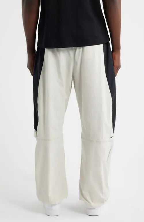 Nike Tech Dri-fit Woven Oversize Stretch Nylon Pants - Light Bone/black
