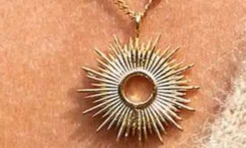 Estée Lauder Sunburst Pendant Necklace
