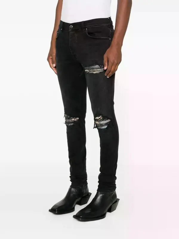 Amiri Patchwork Distressed Cotton Jeans
