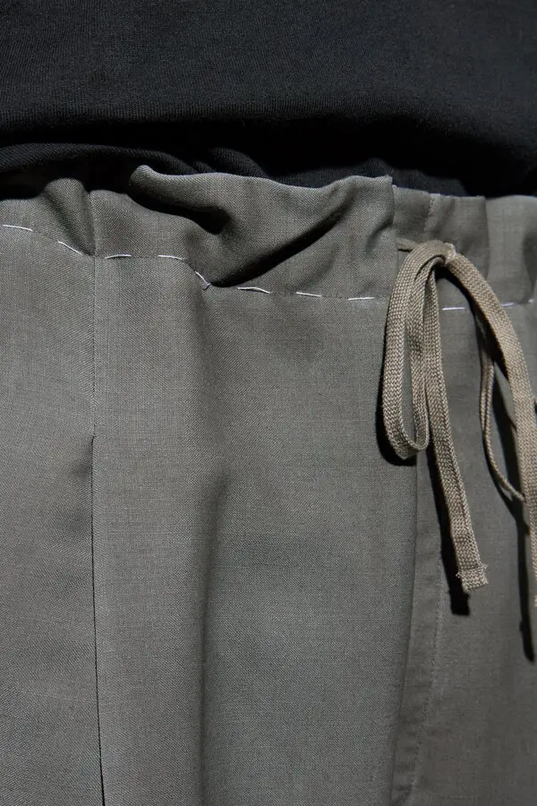 MAISON MARGIELA Creased Trousers With Vintage Effect