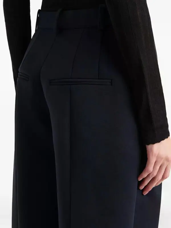 Khaite Button-detailed Pleated Trousers