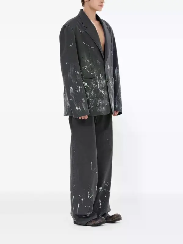 We11Done Pleated Paint-splatter Trousers