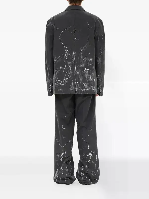 We11Done Pleated Paint-splatter Trousers