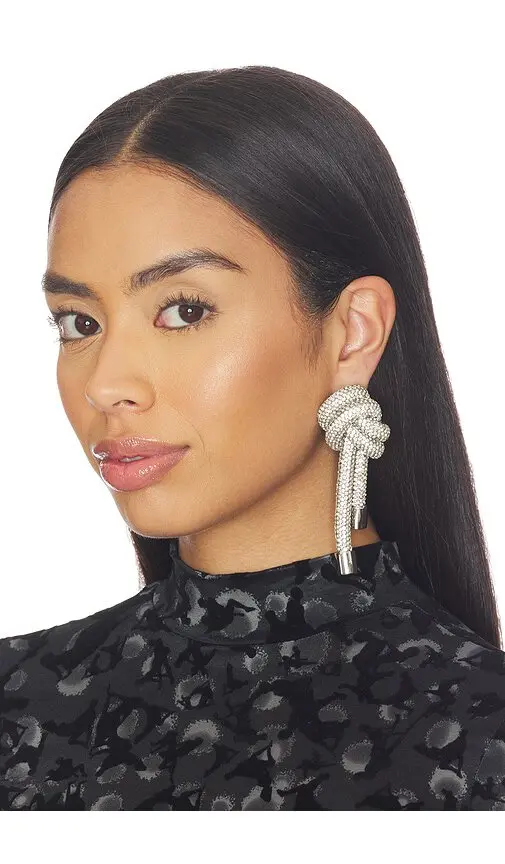 AREA Crystal Knot Dangle Earrings - Metallic Silver