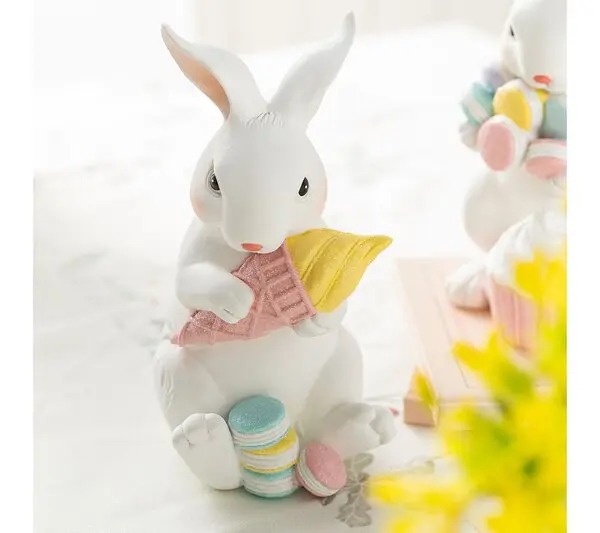GLITZHOME S/2 Easter Resin Bunny Holding Macaro N Table Decor