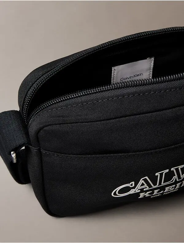 Calvin Klein Curved Logo Graphic Camera Bag