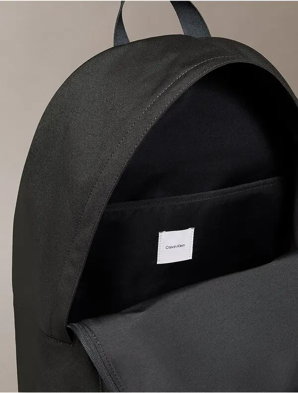Calvin Klein Curved Logo Graphic Round Backpack