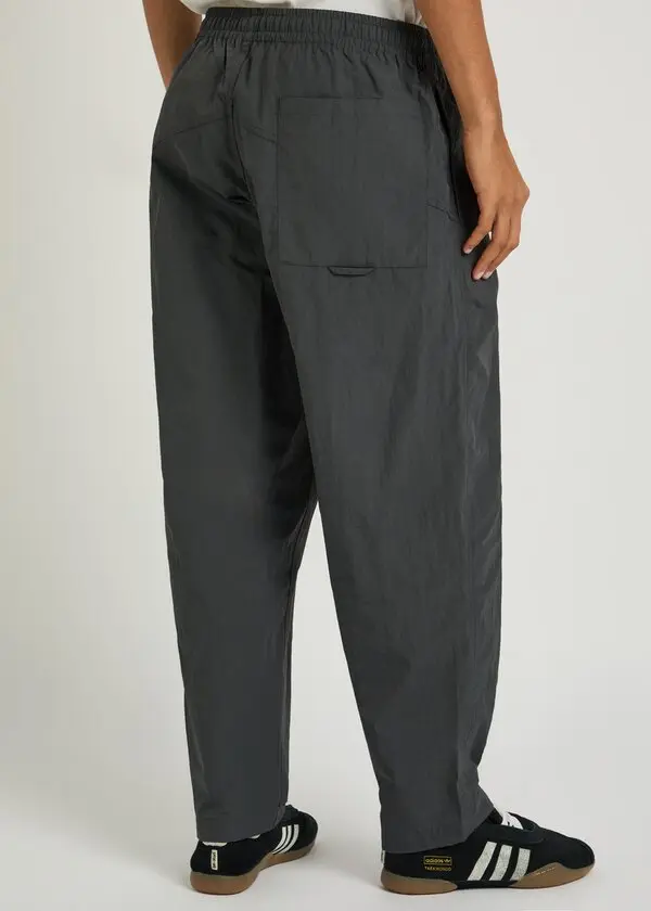 You Must Create Alva Skate Relaxed Tapered-leg Shell Trousers - Charcoal