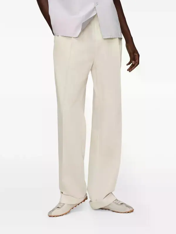MAISON MARGIELA Cuffed Pleated Trousers - Neutrals