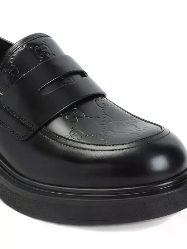 Gucci Monogram Debossed Loafers