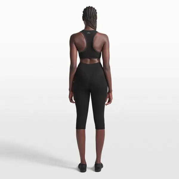 SKIMS Racer Front Bra Obsidian | Black | | Nike Ribbed Seamless - Obsidian/armor
