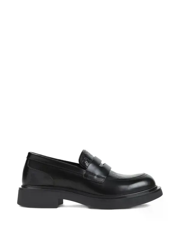 Gucci Monogram Debossed Loafers - Black