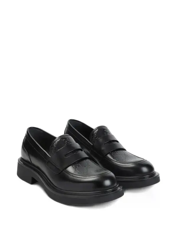 Gucci Monogram Debossed Loafers - Black