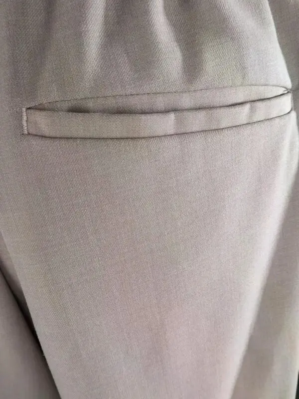 MYTHS Pleated Tapered Trousers