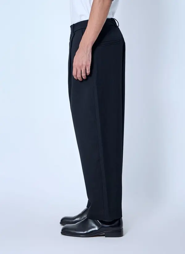 Studio Nicholson Tuck Cotton Tapered Leg Trousers