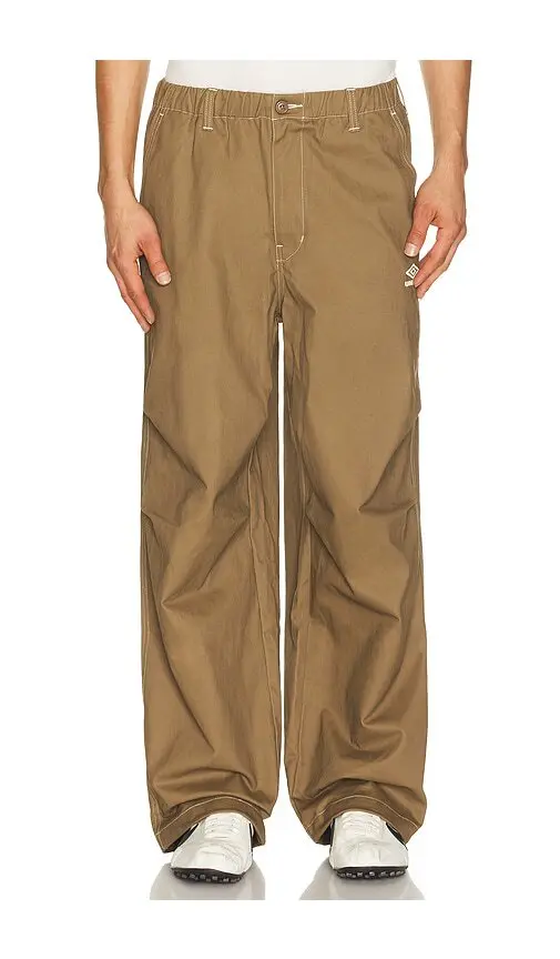 PLEASURES X Umbro Manchester Relaxed Pants In Brown