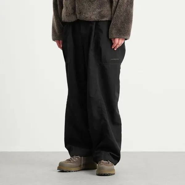 AND WANDER Crinkled Nylon Trousers