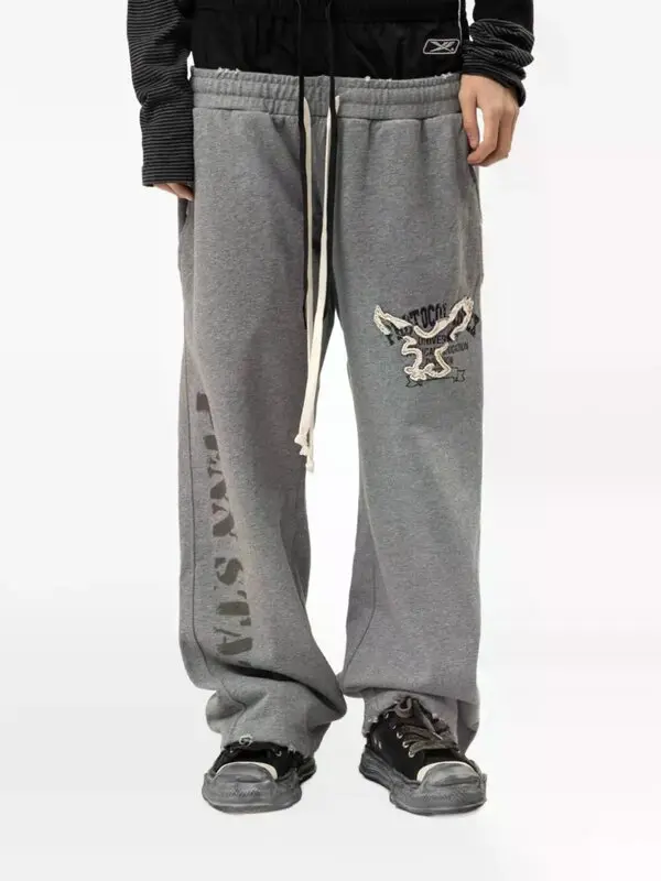 PROTOCOL INDEX Layered Eagle-patch Track Pants