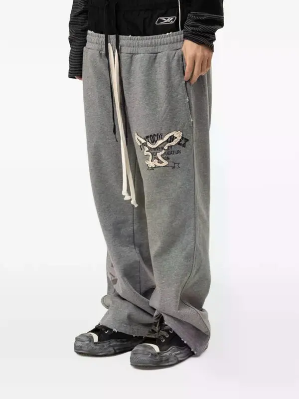 PROTOCOL INDEX Layered Eagle-patch Track Pants