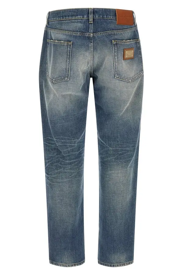 Dolce & Gabbana Distressed Denim Jeans With Signature Plaque