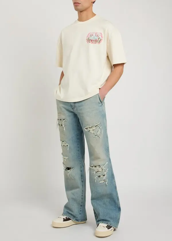 Amiri Checkered Repair Distressed Bootcut Jeans