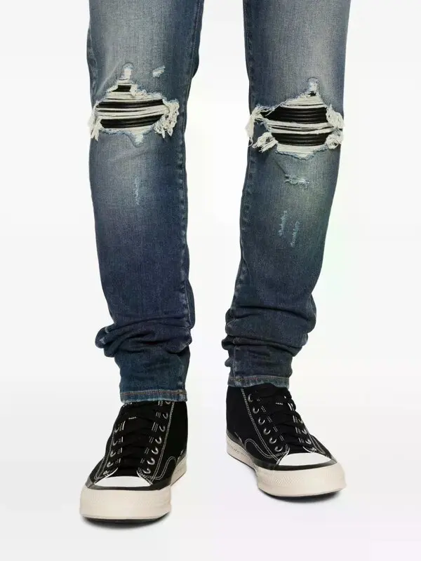 Amiri Ripped-effect Jeans