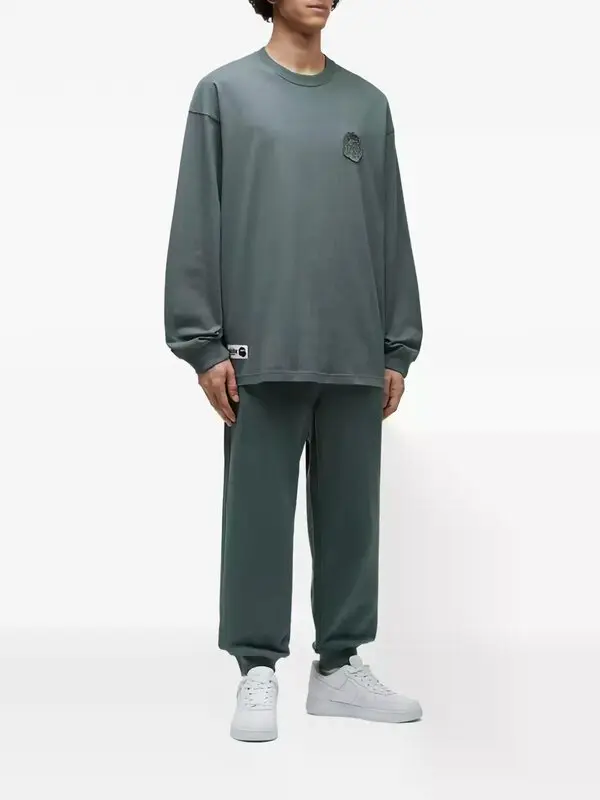FINGERCROXX Logo Patch Trousers