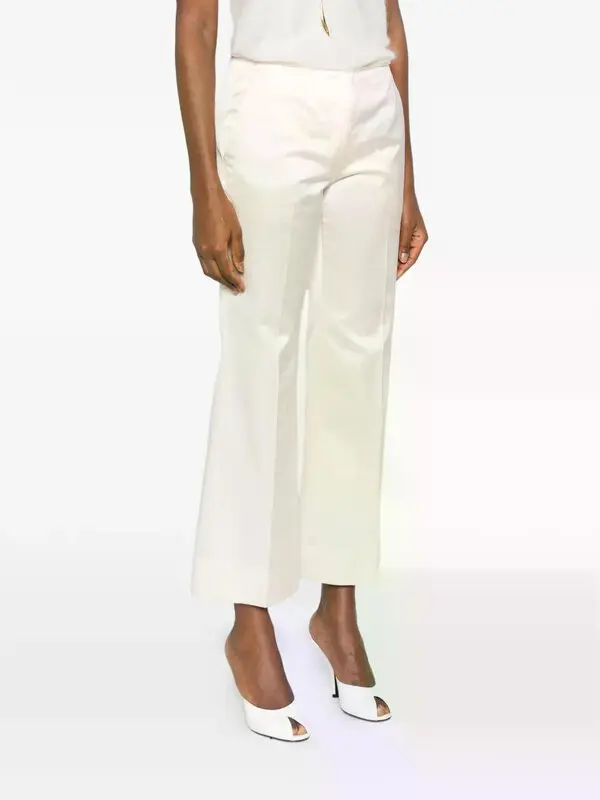 TOTEME Kick Flare Trousers With Raw Edge Hem