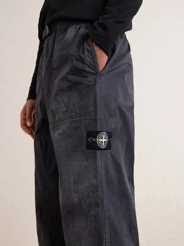 Stone Island Tapered Logo-appliquéd Reflective Nylon Trousers