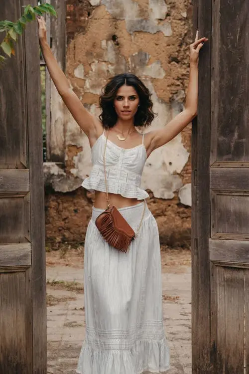 EVA INNOCENTI Maria Mini Crossbody Bag With Fringe