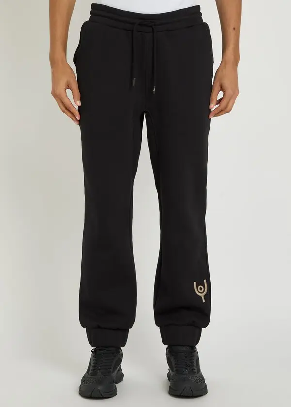 NOW YOU LIVE Magna Logo-embroidered Cotton-blend Sweatpants - Black