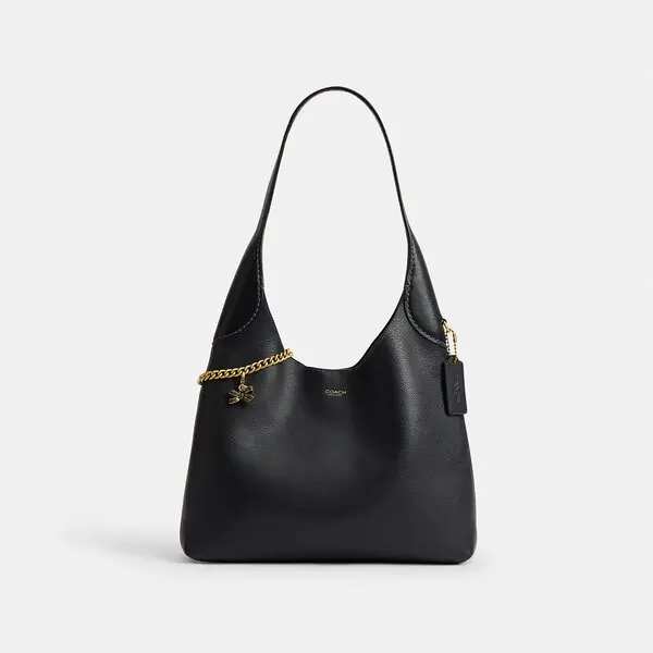 COACH Bow Charm - Brass/black