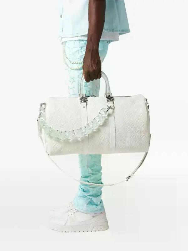 GUAPI Embossed Duffle Bag With Chain Detail