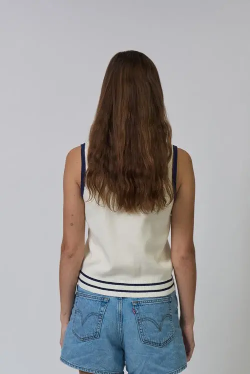 Central Park West Sleeveless Knit Vest With Striped Hem